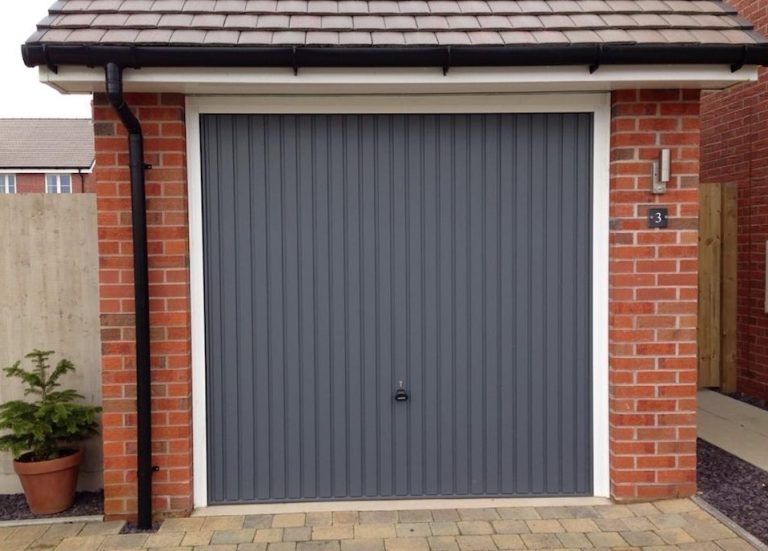 Colourful Garador steel up and over doors on a new housing development ...